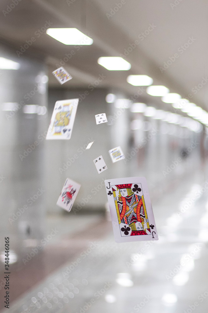 deck of card flying in air in a tunnel of lights in subway Stock Photo ...