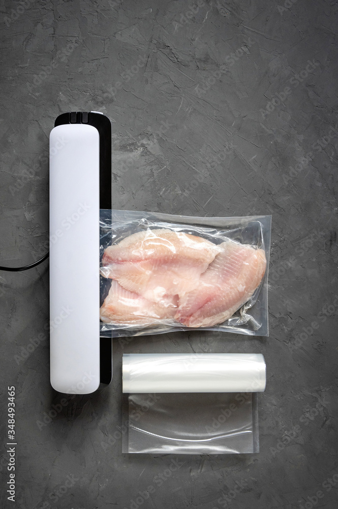 Tilapia fillet in a vacuum bag. Vacuum fish packaging for long-term ...