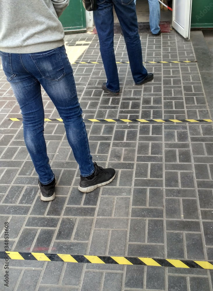 Queue for a store on street. Social distance. Feet of people waiting to ...