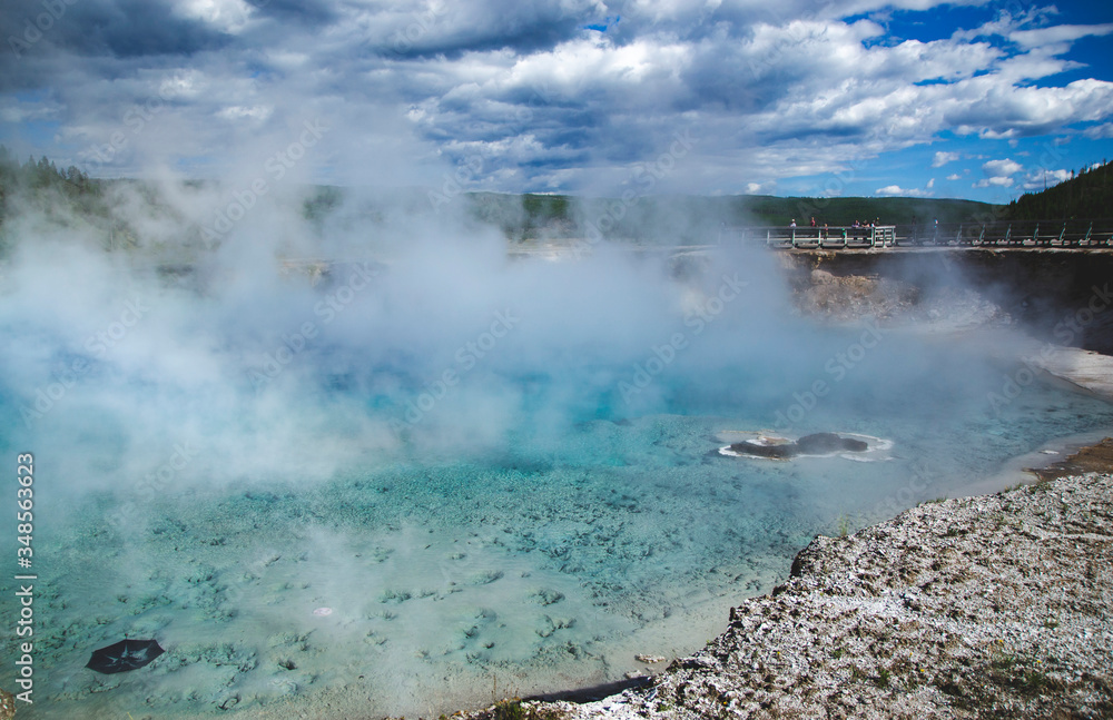 Aquamarine blue pool with huge steam in Yellowstone National Park ...