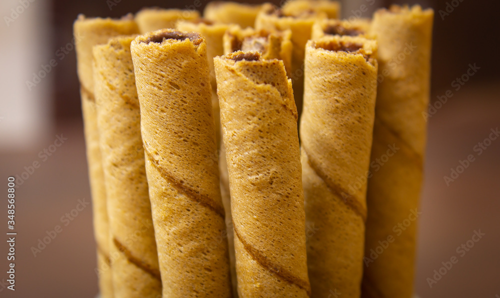 Bunch of chocolate flavored wafer rolls. Crunchy wafer rolls loved by ...