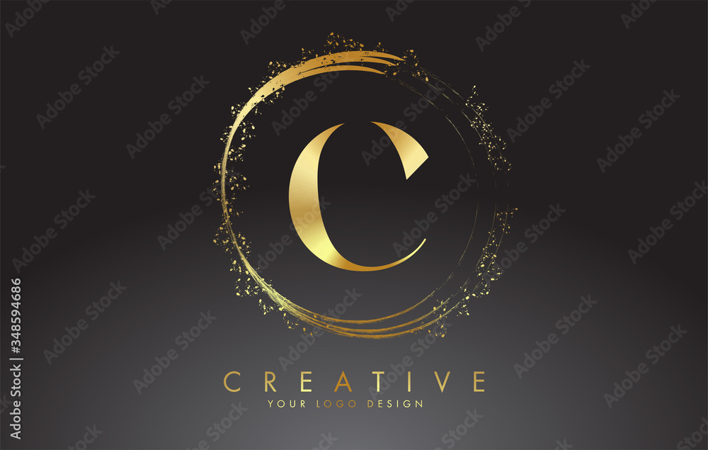 C golden letter logo with golden sparkling rings and dust glitter on a ...