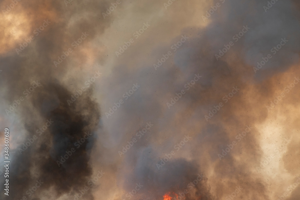 raging dust smoke pattern background of fire burn in grass fields ...
