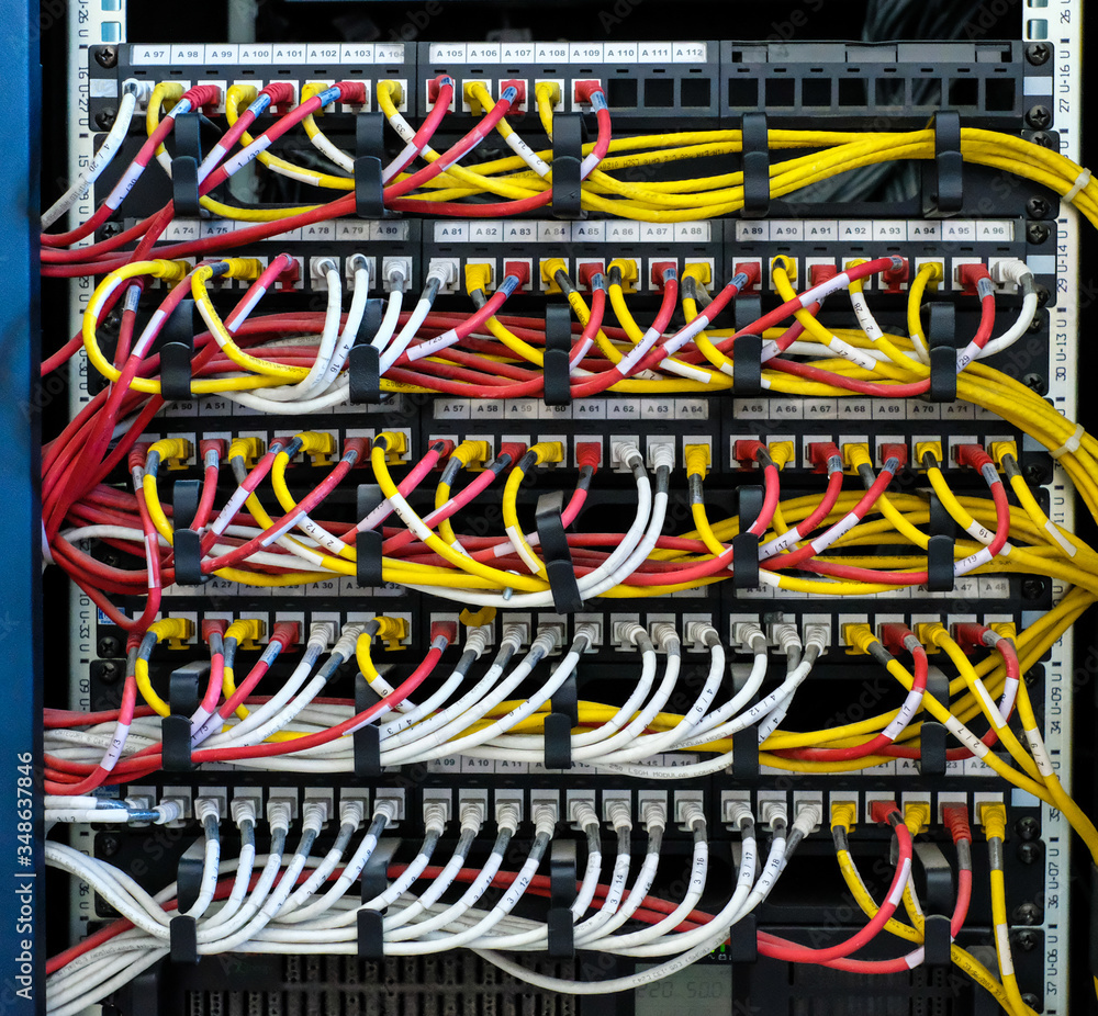 Network routers of ISP. Many wires connect to the network interfaces of ...