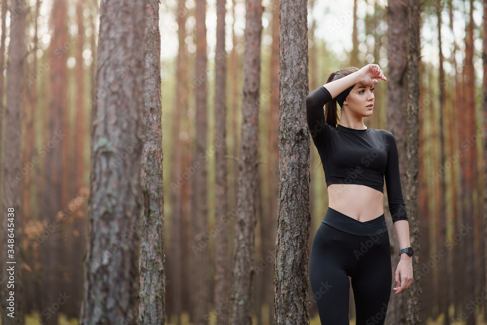 Beautiful fit girl. Fitness model outdoors. Female runner during ...