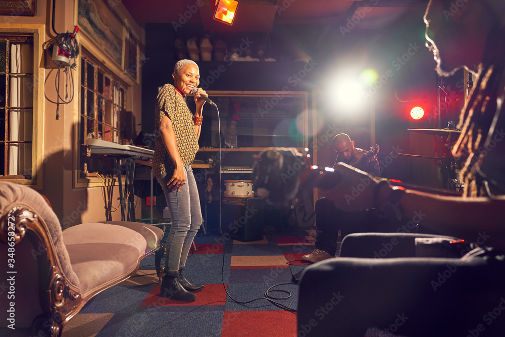 Musicians practicing in recording studio Stock Photo | Adobe Stock