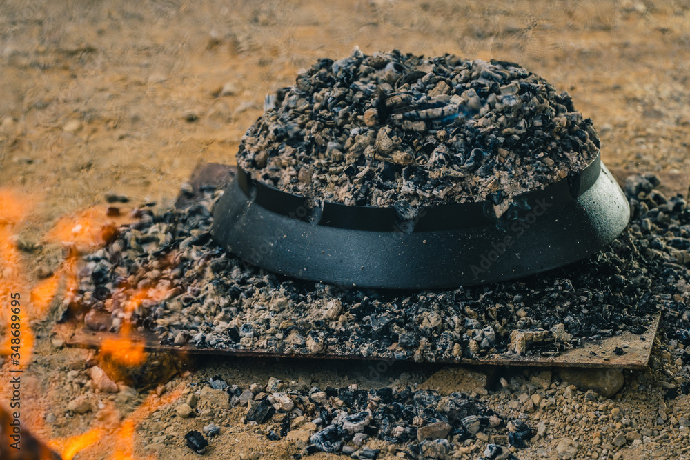 Cooking traditional balkan turkish bosnian dalmatian meal Peka in metal ...