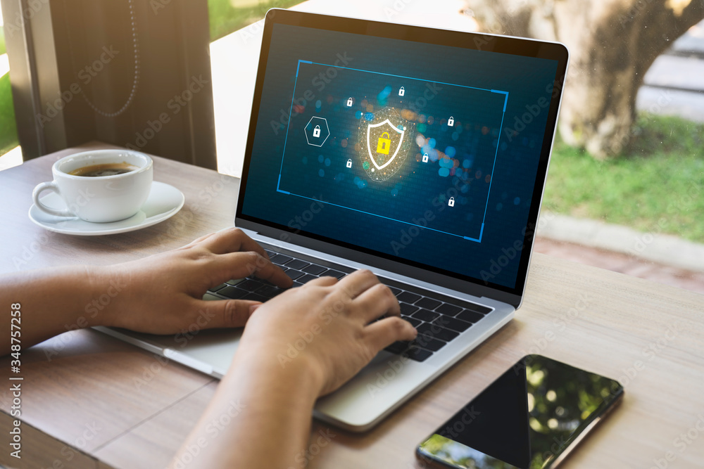 Person using a Laptop Computer with data protection, Cyber security ...
