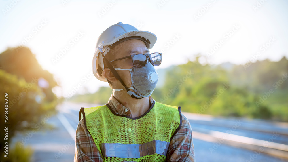 A engineer under inspection and checking construction railroad station ...