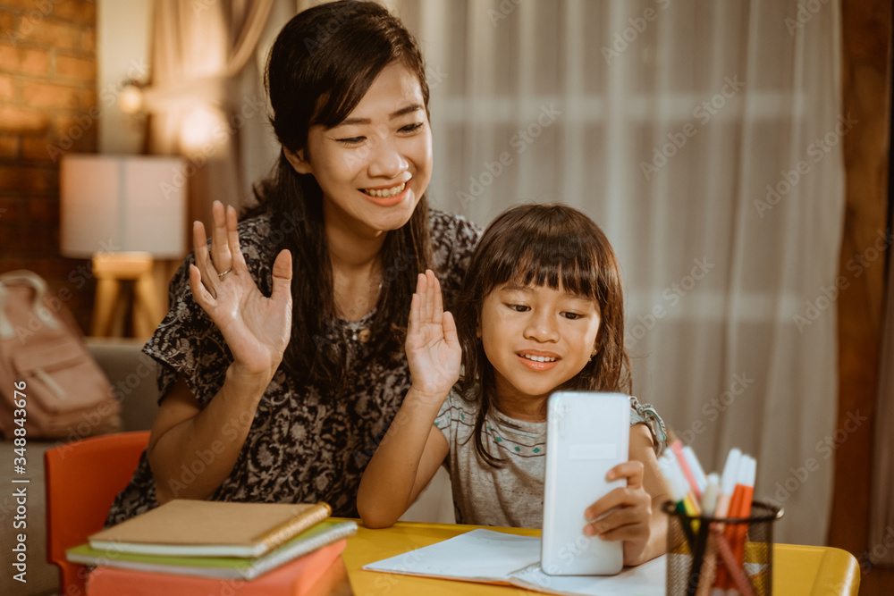 communication using video call. mother and daughter calling with ...