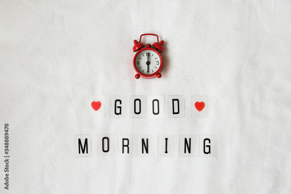 Inscription Good morning, red analog clock, small heart on white ...