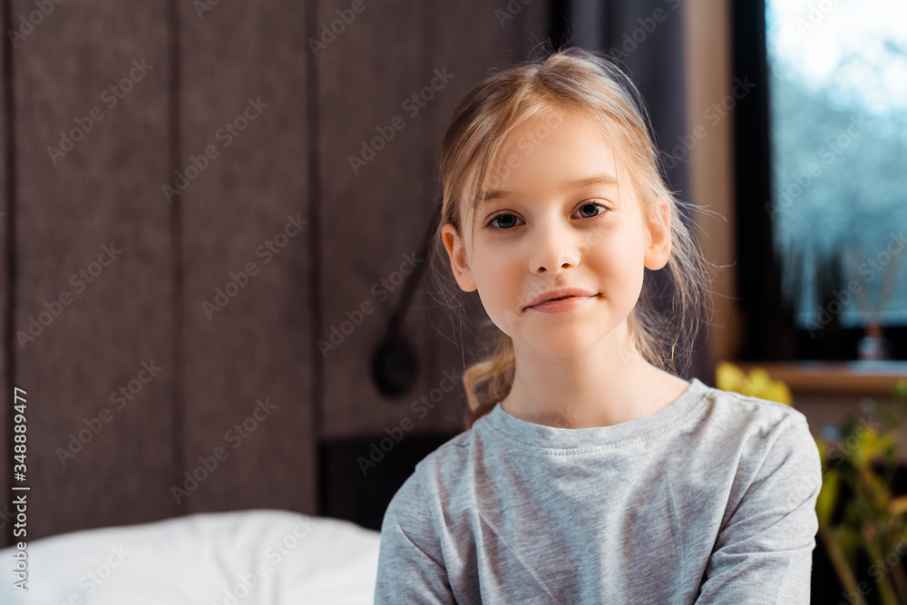 cute child looking at camera and smiling at home Stock Photo | Adobe Stock