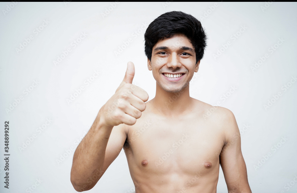 Mid shot of young guy 20s posing isolated on pastel blue wall ...