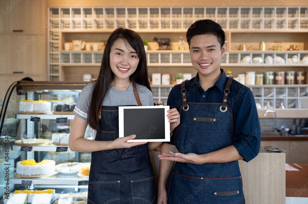 New couple small business owners running coffee shop together with ...