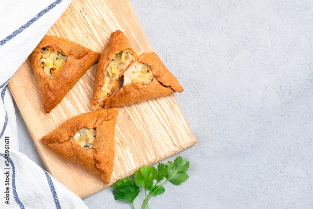 Tatar traditional triangular pastry with potatoes, onion, meat on ...