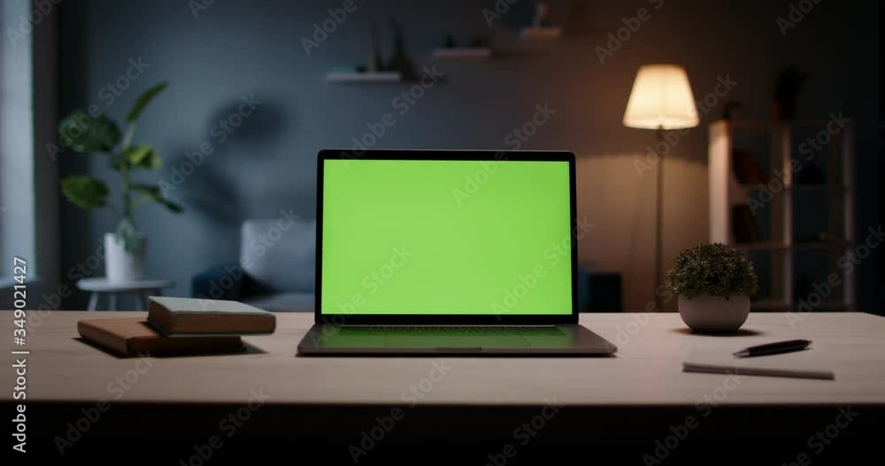 Close up shot of modern chroma key green screen laptop computer set up ...