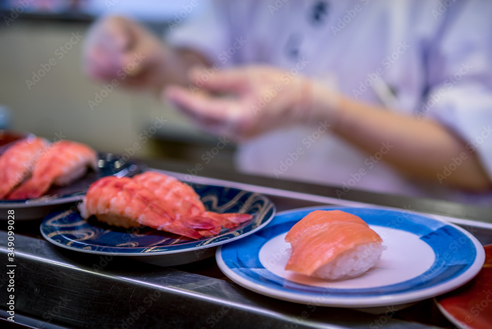 Sushi on conveyor belt in Japan restaurant. Traditional Kaitenzushi ...