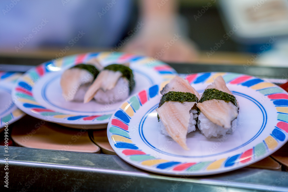 Sushi on conveyor belt in Japan restaurant. Traditional Kaitenzushi ...