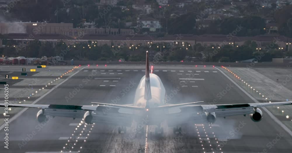 Scenic view of an airliner arriving in San Diego airport and landing on ...