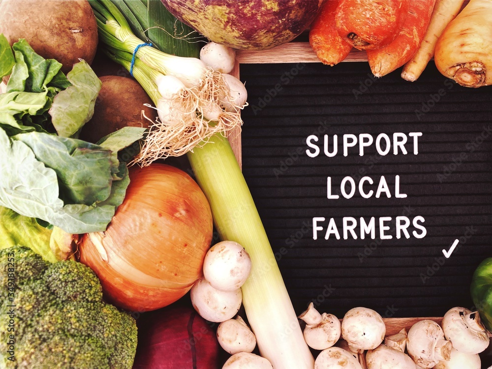 Support local farmers sign against a rustic background of fresh ...
