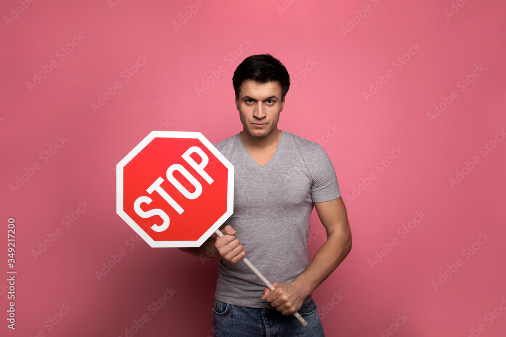 Don't do that. Close-up photo of a serious young strong man, who is ...