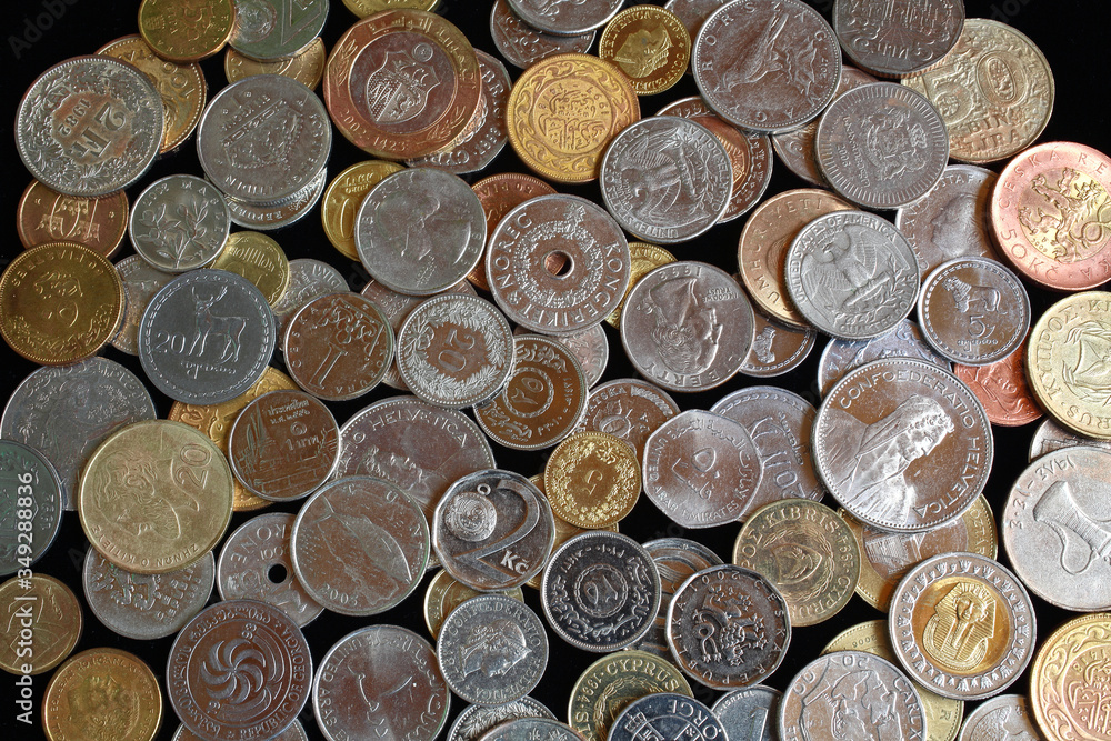 Scattering of coins from different countries and continents. Background ...