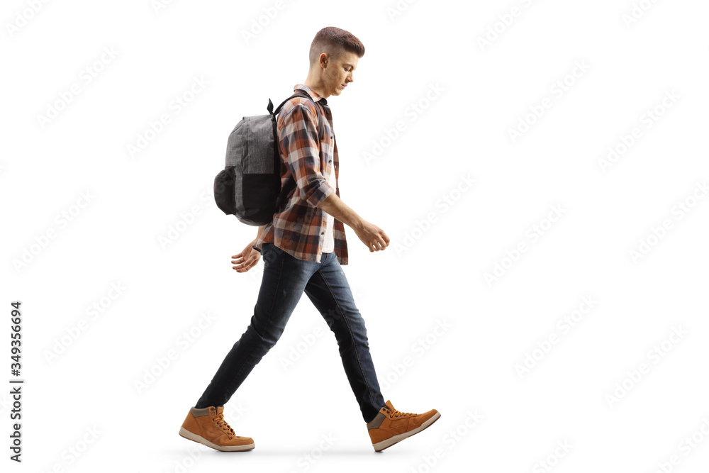 Sad male teenage student walking Stock Photo | Adobe Stock