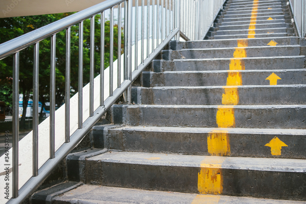 Concrete stairs without people. Arrows indicate movement on the stairs ...