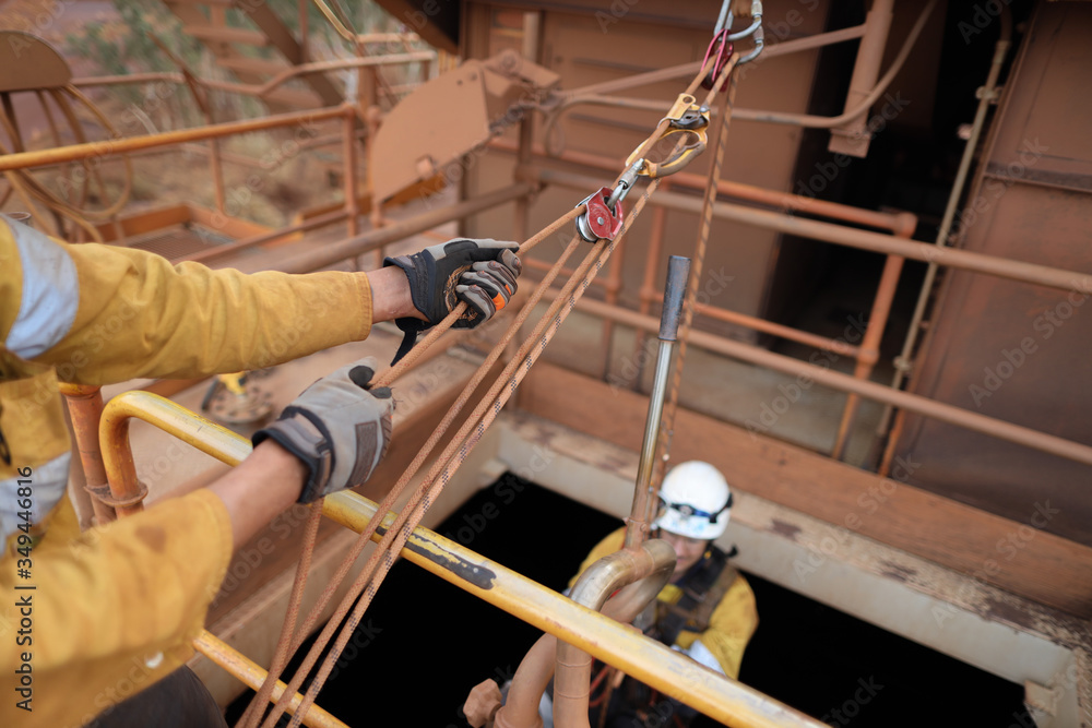 Male rope access industry worker hand wearing hand safety glove ...
