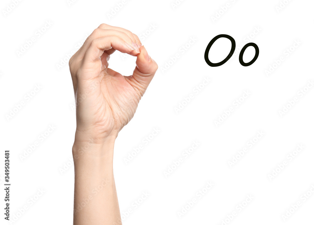 Woman showing letter O on white background, closeup. Sign language ...