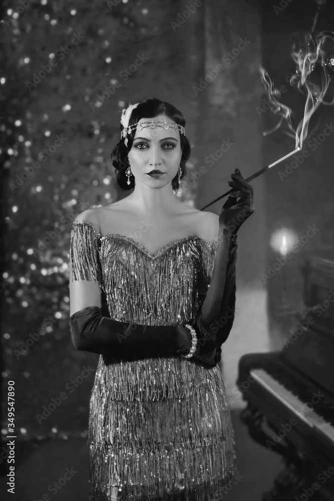 Artwork portrait young flapper retro beautiful woman. mouthpiece in hand cigarette smoke ...