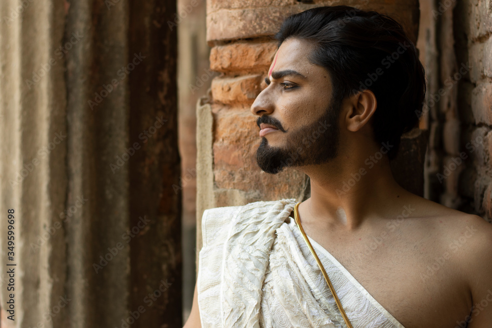 Portrait of an Indian pujari/ worshiper in bare body Indian ethnic ...