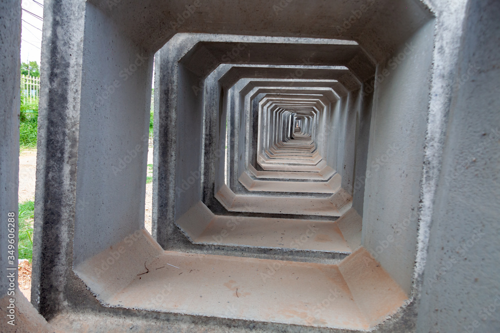 concrete pipes on a large storage area. They are used for culverts foto ...