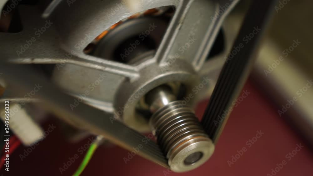 Extreme close up of washing laundry machine electric motor shaft ...