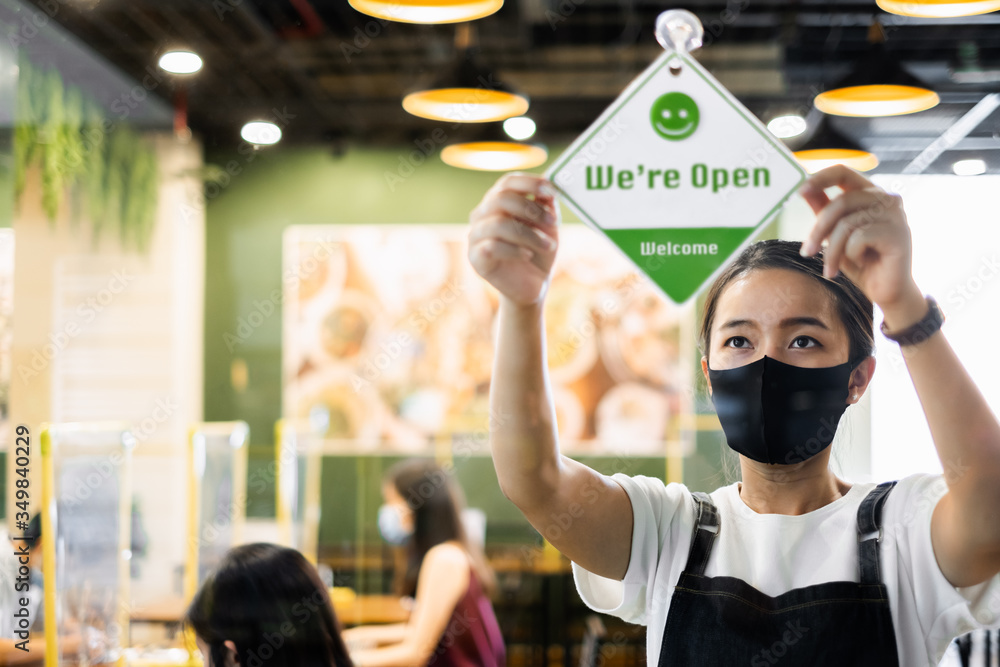 Business owner Asian woman wear protective face mask ppe hanging open ... Business owner Asian woman wear protective face mask ppe hanging open ...
