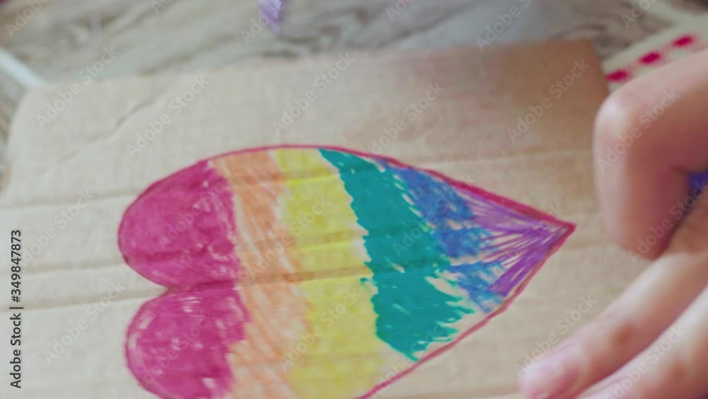 Pride day 2020. Female drawing rainbow flag on carton. Preparation ...