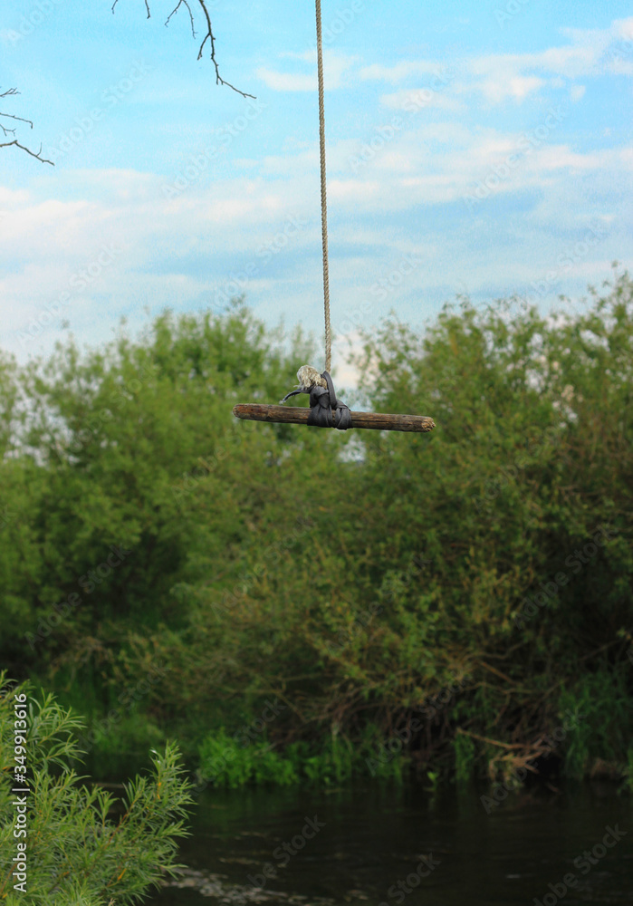tarzanka russian bungee jump over the water is hanging on a tree above ...