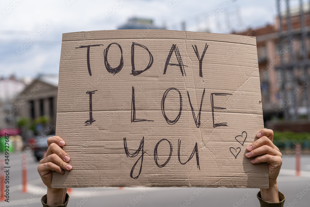 admirer romantic declaration of love on the street cardboard lettering ...
