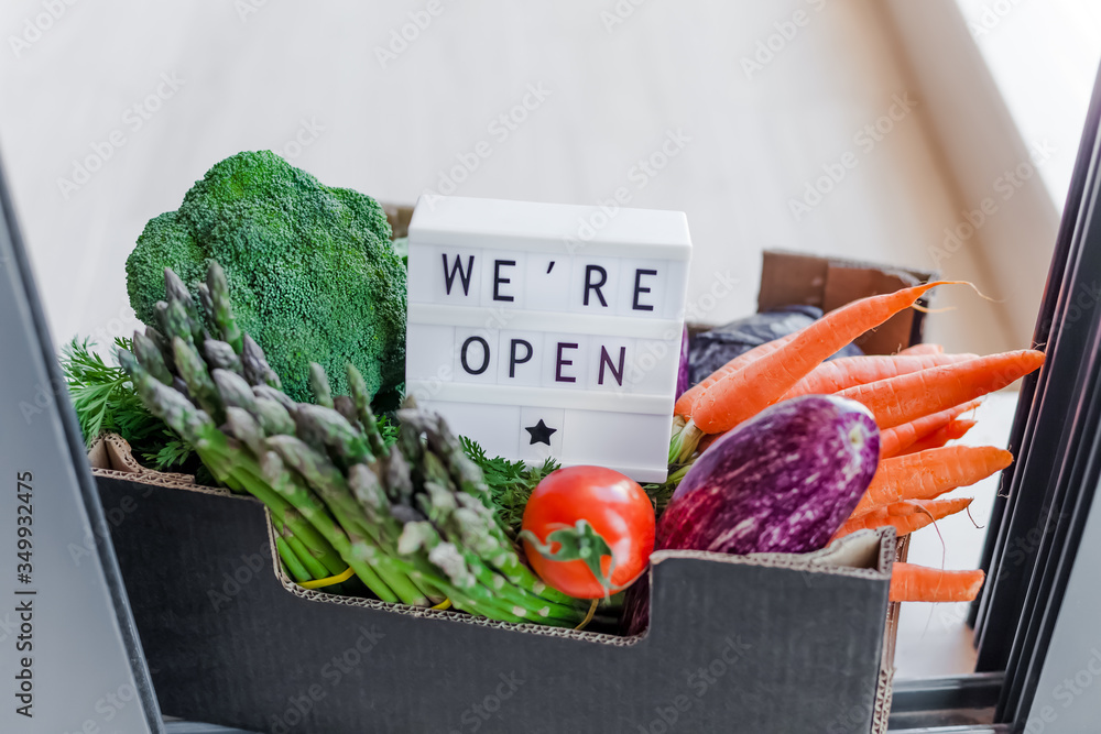 Text We're open and Fresh green and vegetables box Stock Photo | Adobe ...