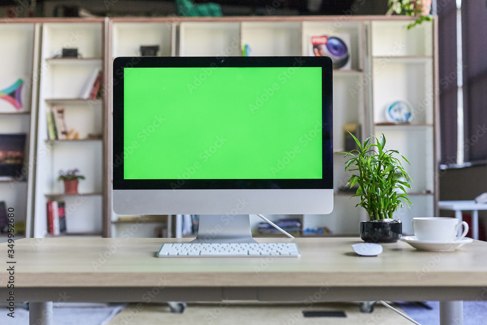 Computer desktop with mock-up green screen white background in office ...