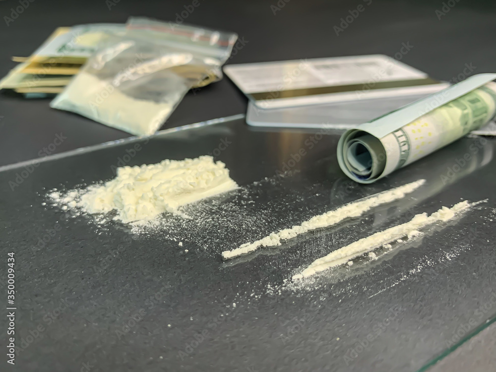 Rolled 100 us dollars, 2 lines of cocaine, plastic bag with illegal ...