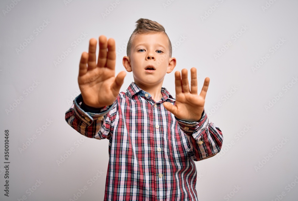 Young little caucasian kid with blue eyes wearing elegant shirt ...