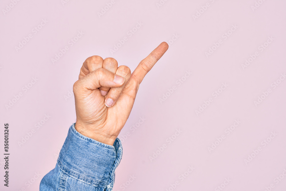 Hand of caucasian young man showing fingers over isolated pink ...