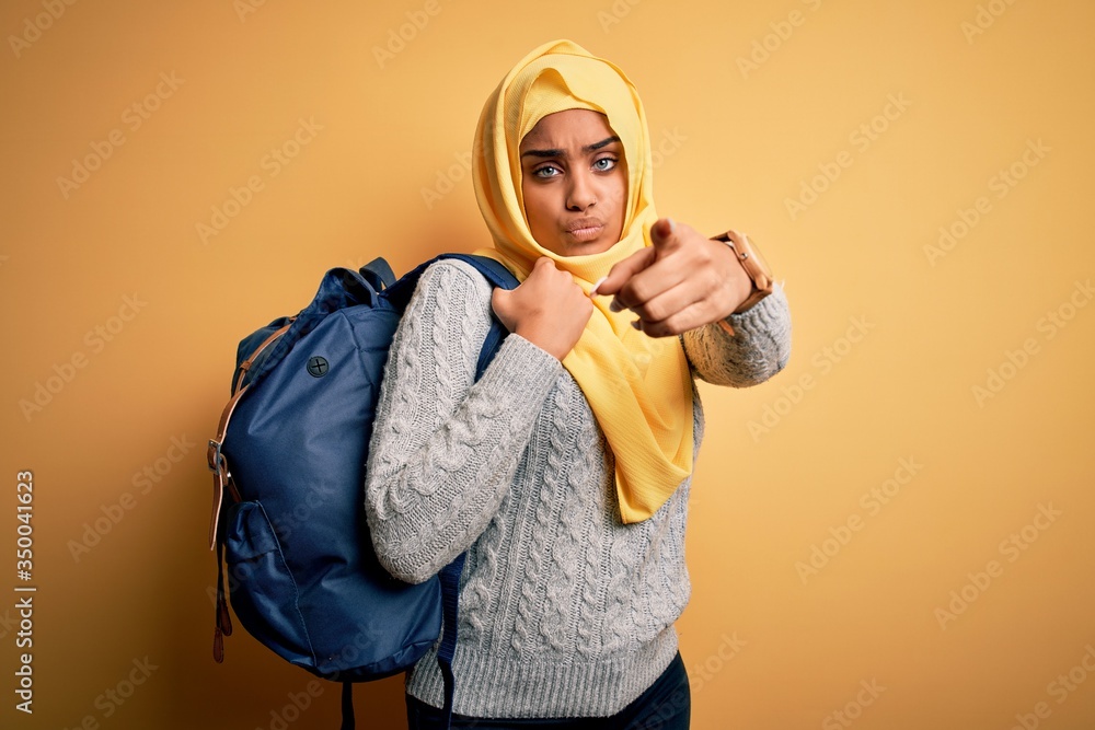 Young african american student girl wearing muslim hijab and backpack ...