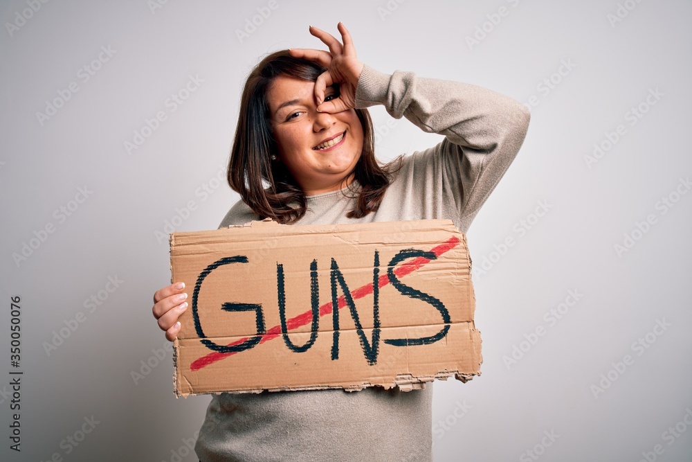 Plus size woman holding stop guns cardboard banner warning about ...