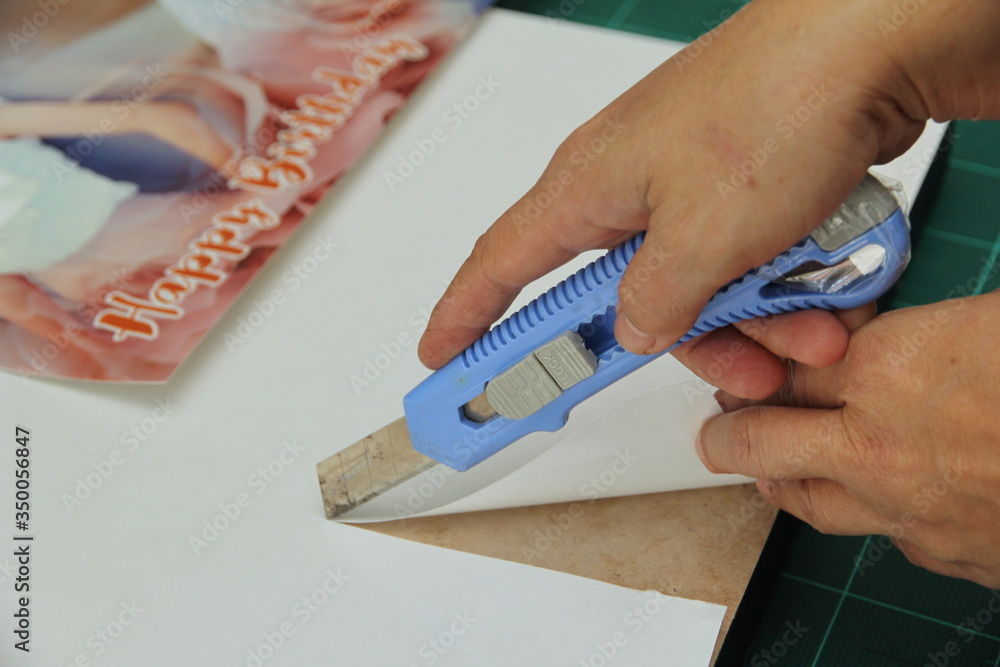 Hand cutter knife cut paper cover on board ,Wood Float Frame with shown ...