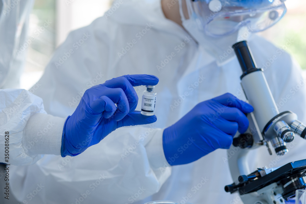 Scientists are done research on vaccine in laboratory with test tubes ...