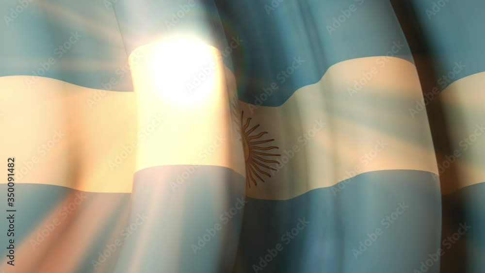 The sun shines with golden rays through the waving flag of argentina ...