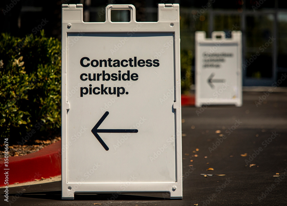 Sign advertising Contactless Curbside Pickup at retail store parking ...