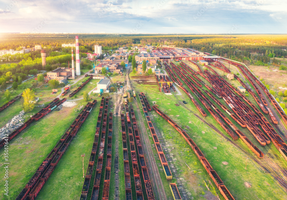Aerial view of freight trains. Railway station with wagons. Heavy ...